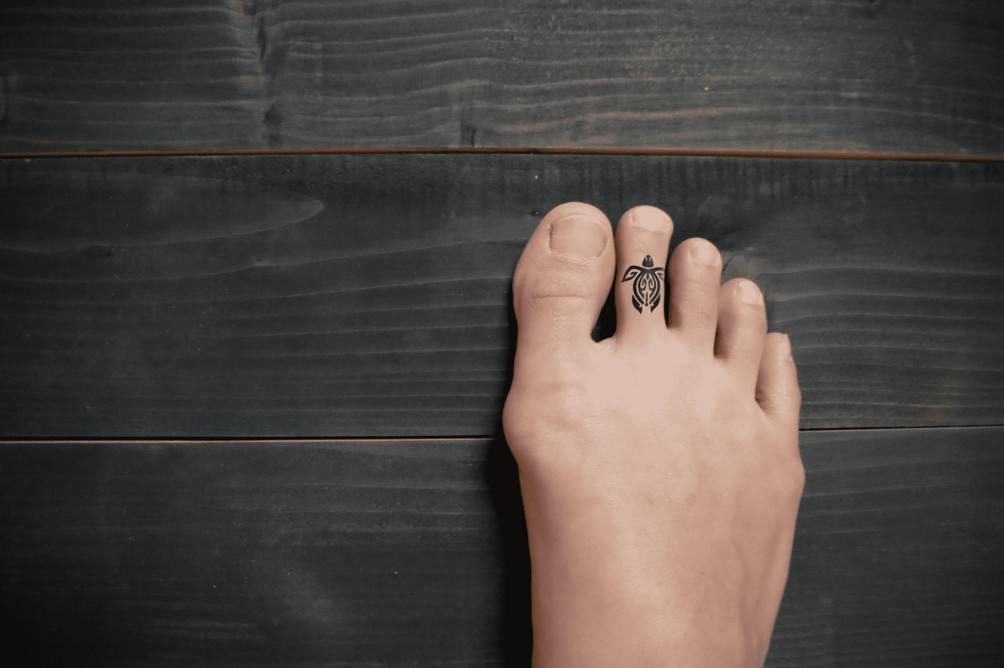 Toe tattoos to cover corns